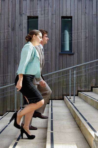 Business people walking up steps - Royalty-free Stock Photo | Dissolve