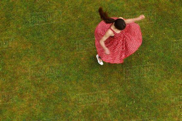 Woman spinning outdoors - Royalty-free Stock Photo | Dissolve