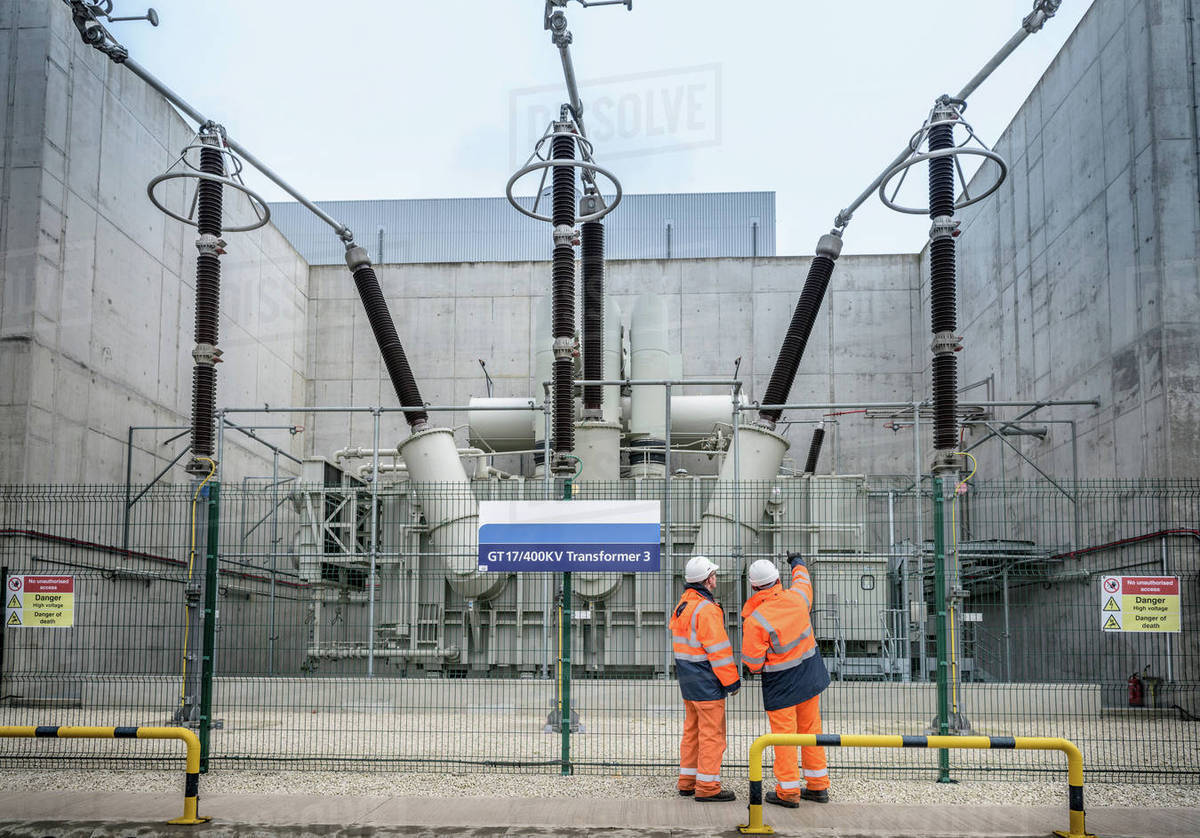 Workers with 400KV transformer in gas-fired power station - Stock Photo ...