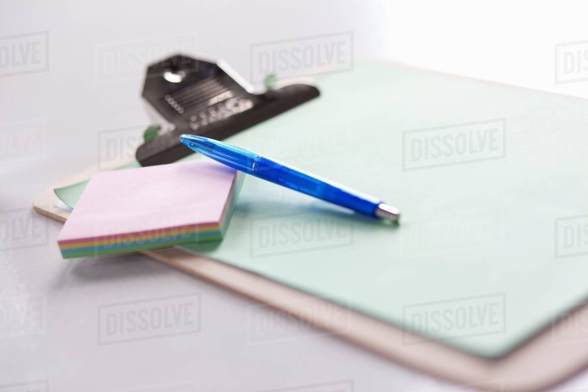 Clipboard, post-it notes, and pen - Royalty-free Stock Photo | Dissolve