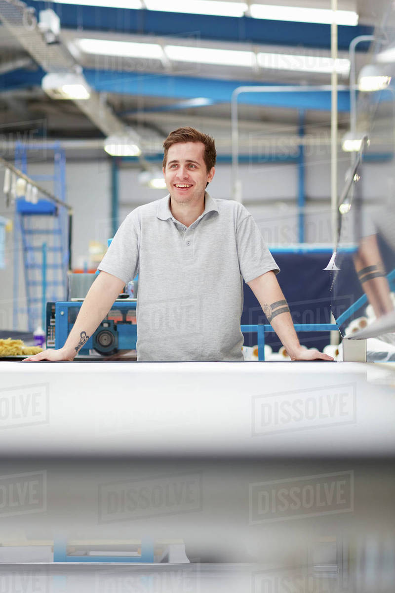 Portrait of factory worker in roller blind factory - Stock Photo - Dissolve