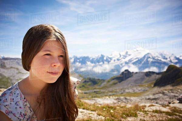 Girl standing in rocky landscape - Royalty-free Stock Photo | Dissolve