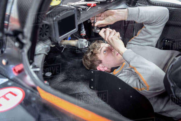 Engineer constructing racing car in racing car factory - Stock Photo ...