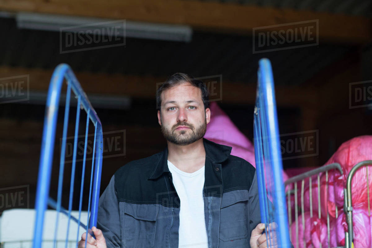 Man pushing roll cage - Royalty-free Stock Photo | Dissolve