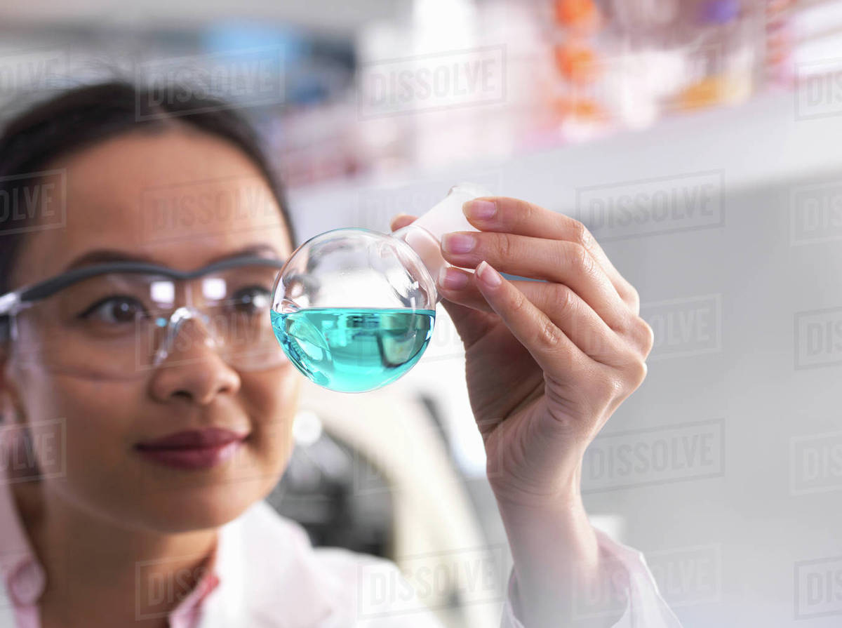 A scientist preparing a chemical formula in a laboratory - Royalty-free ...