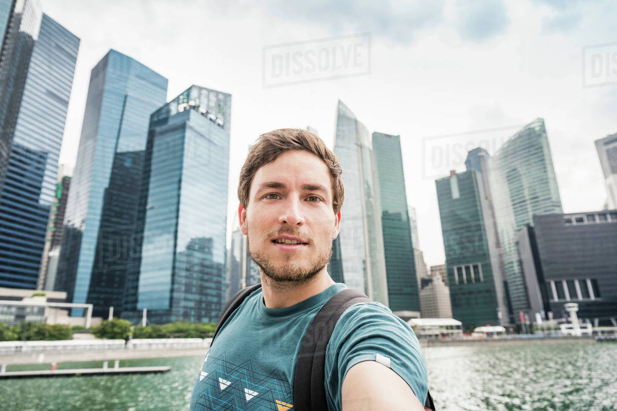 Tourist posing in front of Singapore skyline, Marina Bay - Royalty-free ...