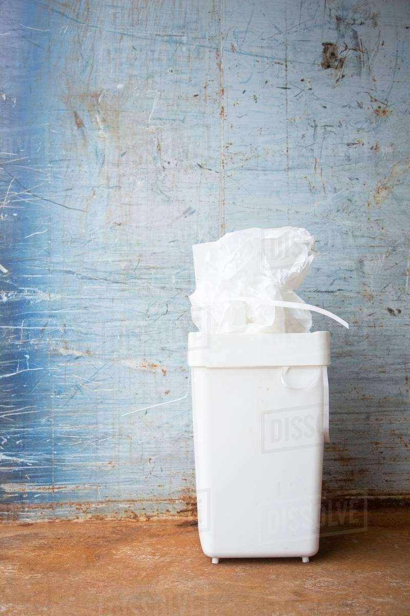 Bin full of paper for recycling in front of wall - Royalty-free Stock ...