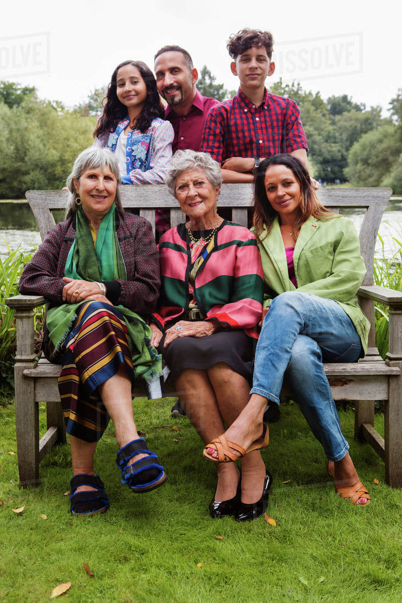 Portrait of four generation family, beside lake, smiling - Royalty-free ...