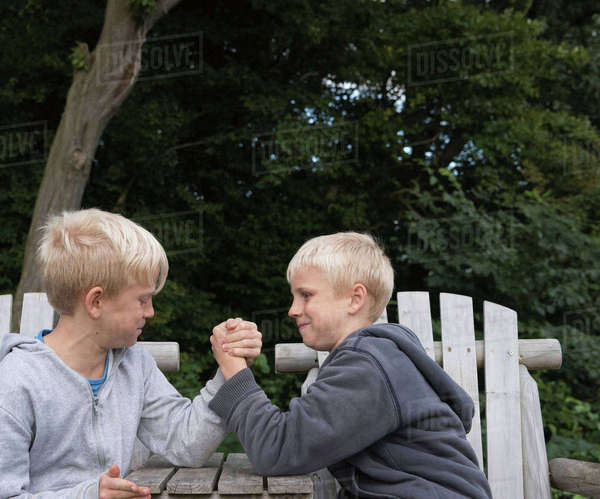 Boys arm wrestling - Stock Photo - Dissolve