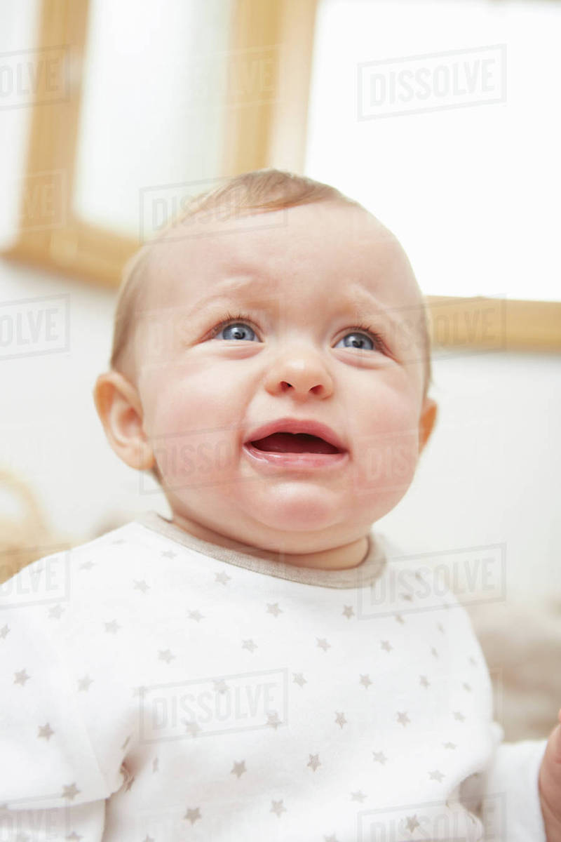 Baby girl at home, crying, close-up - Royalty-free Stock Photo | Dissolve