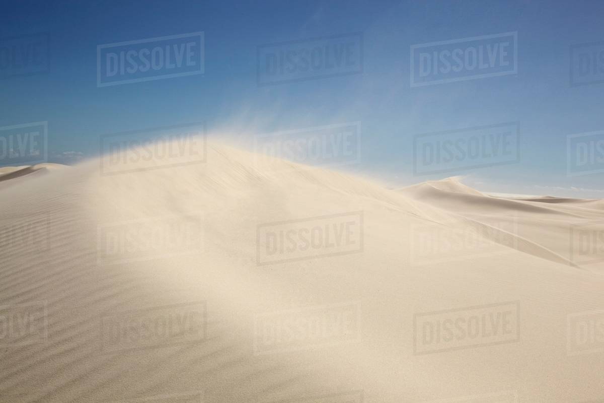 Wind blowing sand on dunes - Royalty-free Stock Photo | Dissolve