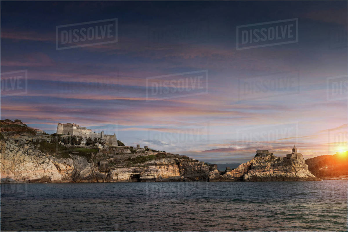 View of Church of St Peter on headland at sunset, Porto Venere, Liguria ...