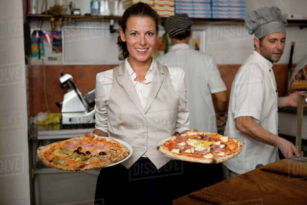 People in a pizzaria - Royalty-free Stock Photo | Dissolve