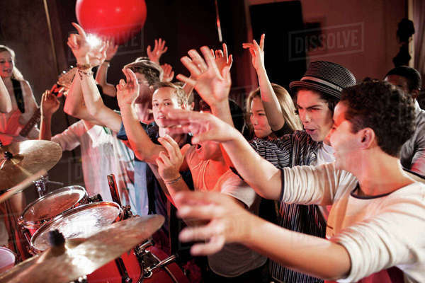 Teenagers dancing at concert - Royalty-free Stock Photo | Dissolve