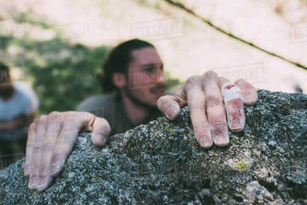 Hands of male boulderer gripping boulder edge, Lombardy, Italy - Stock ...