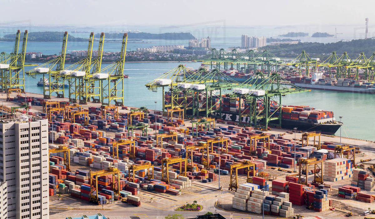 Elevated view of container terminal, cranes and container ship ...
