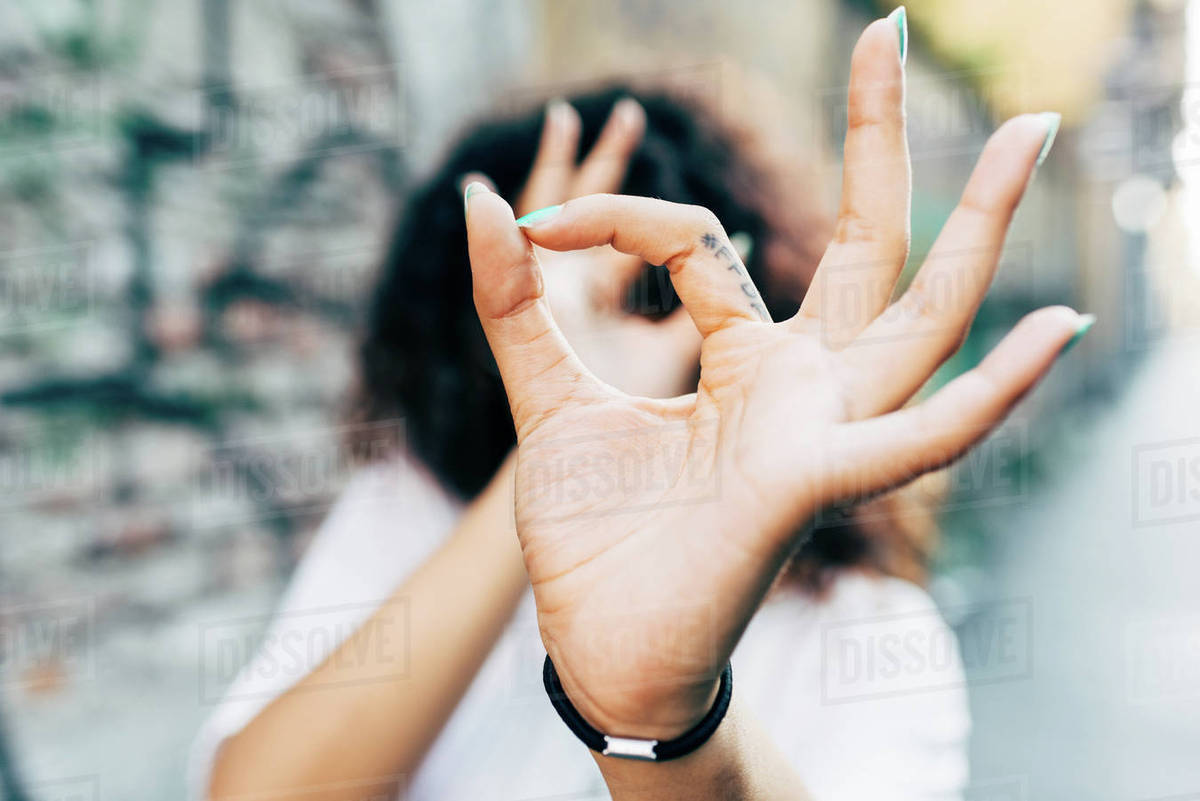Woman making hand gestures, Milan, Italy - Royalty-free Stock Photo ...