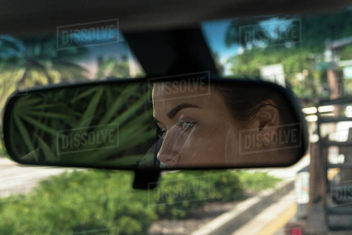 Young woman's face in car mirror, Florida, USA, close up - Royalty-free ...