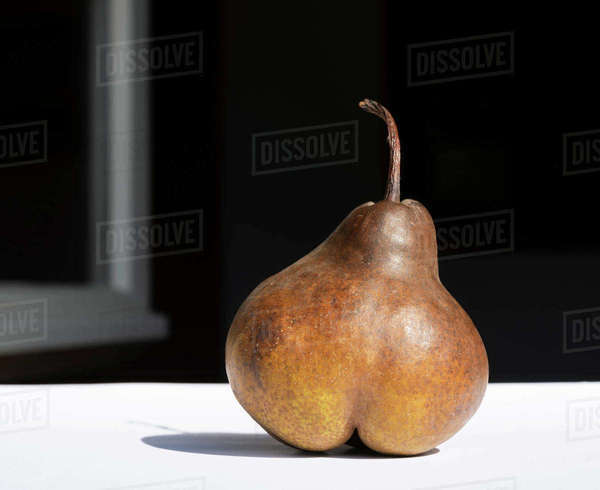 Pear in morning sun - Stock Photo - Dissolve