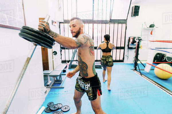 Male boxer lifting weights - Royalty-free Stock Photo | Dissolve