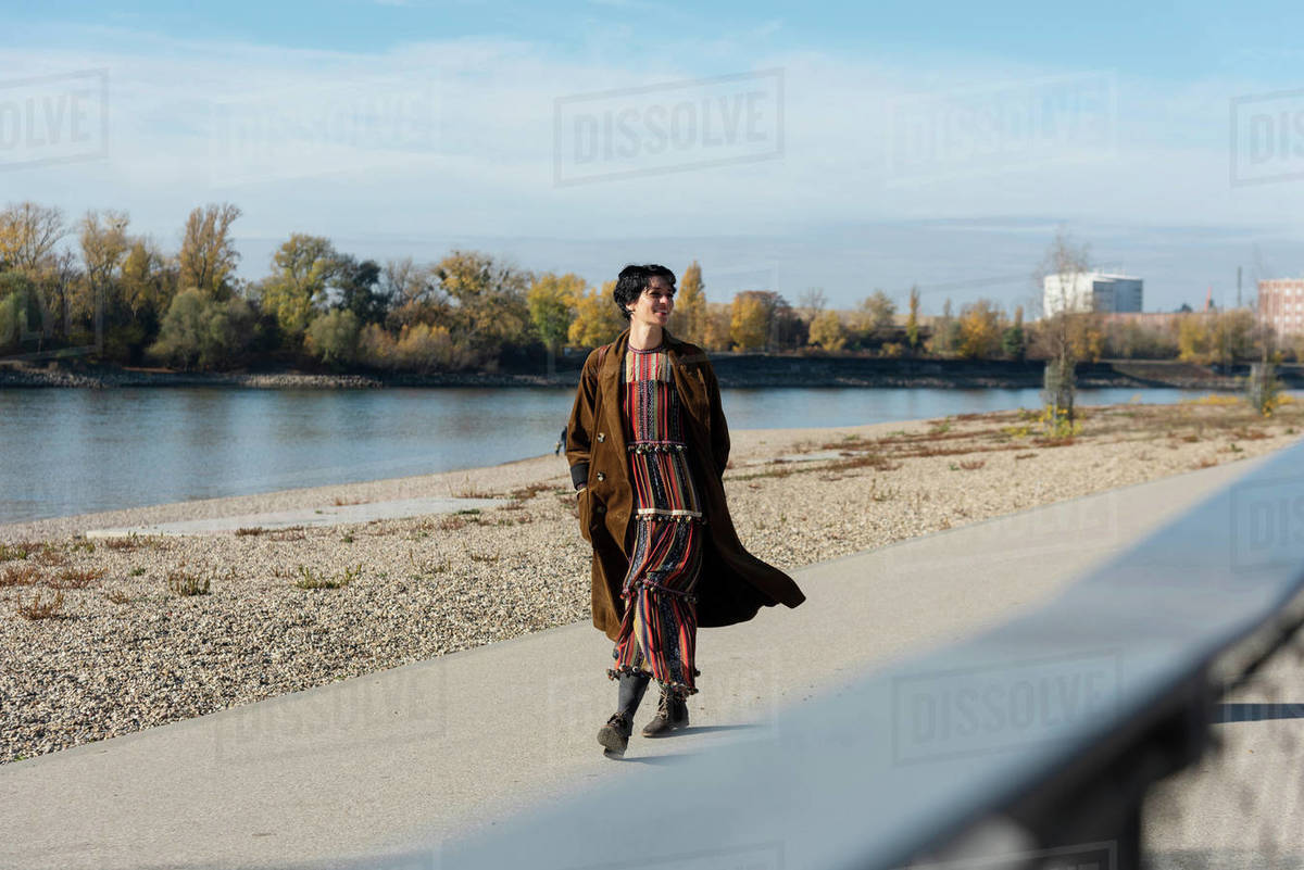 Woman walking along Rhine River, Strandbad, Mannheim, Germany - Royalty ...