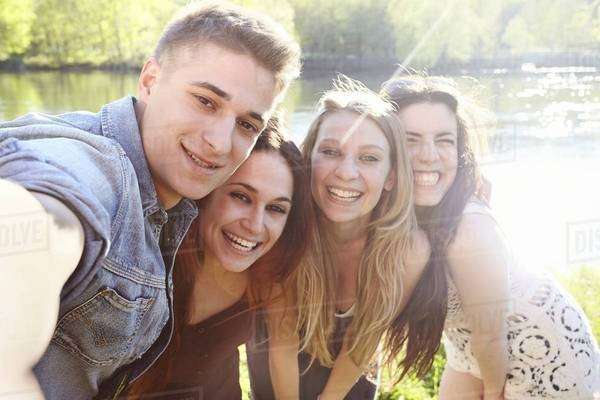 Group of friends in sunlight, posing - Royalty-free Stock Photo | Dissolve