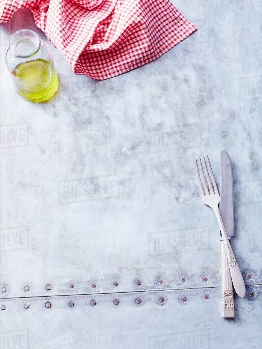 Olive oil, napkin and cutlery - Stock Photo - Dissolve