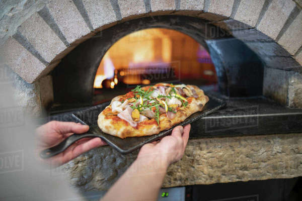 Chef putting Pinsa Romana, a Roman style pizza blend reducing sugar and ...