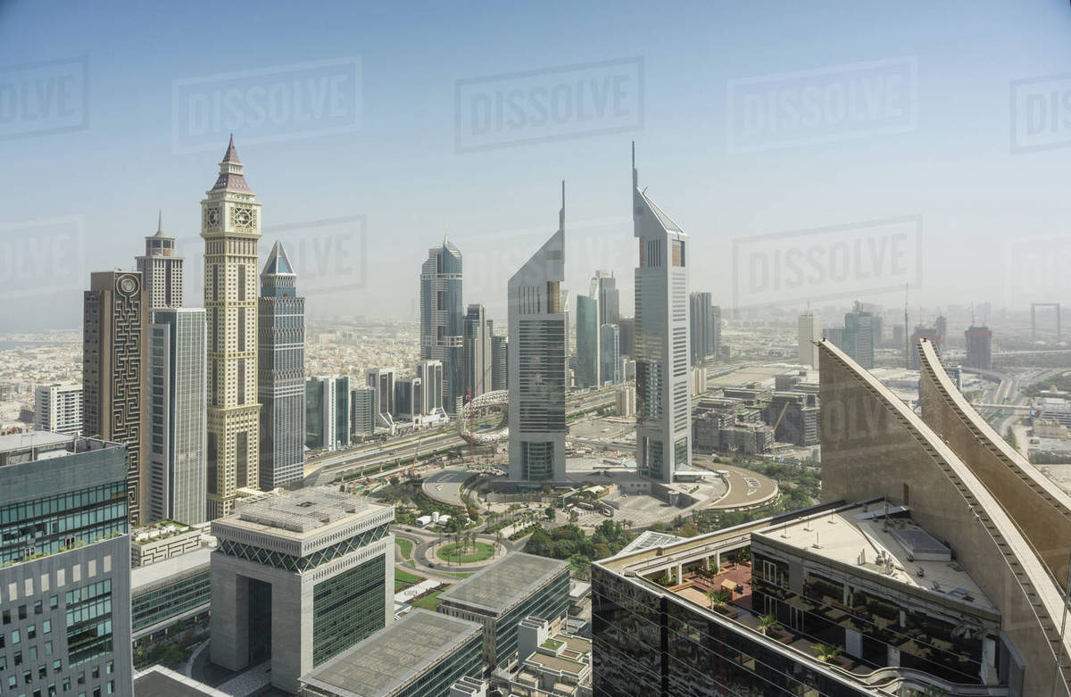 Dubai Clock Tower and Jumeirah Emirates Towers, Dubai, UAE - Royalty ...