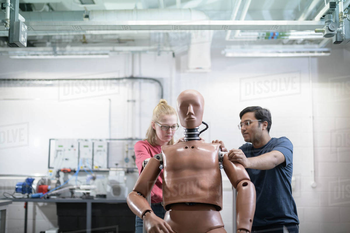 Two students working on a test dummy in a workshop. - Royalty-free ...