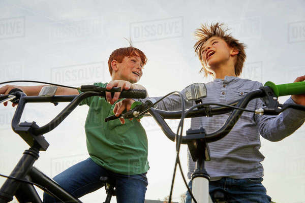 Two boys riding their BMX bikes. - Royalty-free Stock Photo | Dissolve