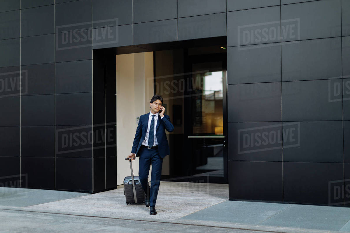Businessman leaving on business trip - Royalty-free Stock Photo | Dissolve