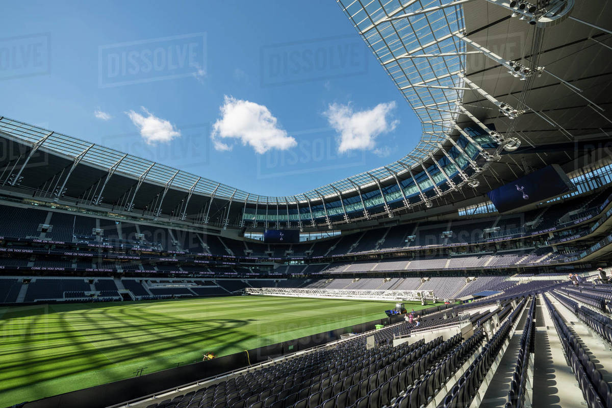 Tottenham Hotspur football stadium, empty stands and sunshine on the ...