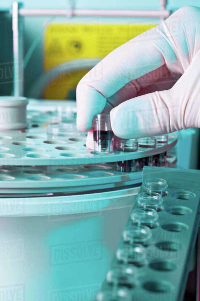 A scientist operates advanced laboratory equipment - Stock Photo - Dissolve