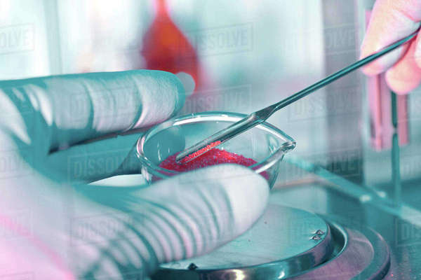 A scientist conducts lab research with precision instruments and ...