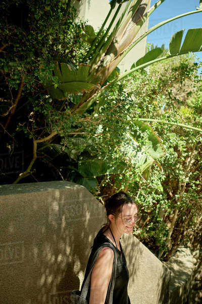 Young woman in bikini enjoying sunshine by the water's edge - Royalty ...