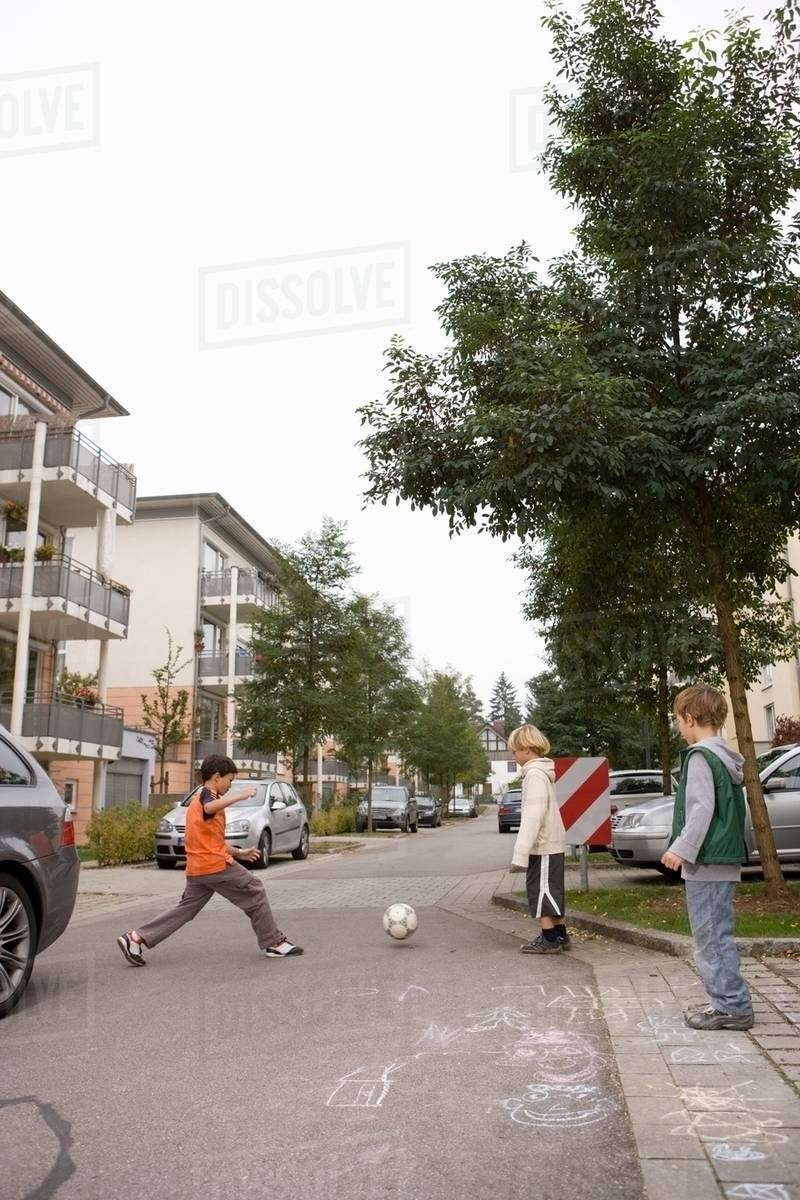 Children playing on suburban street - Stock Photo - Dissolve