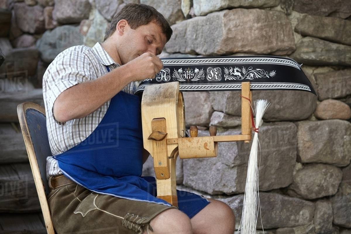 Worker weaving in shop - Stock Photo - Dissolve