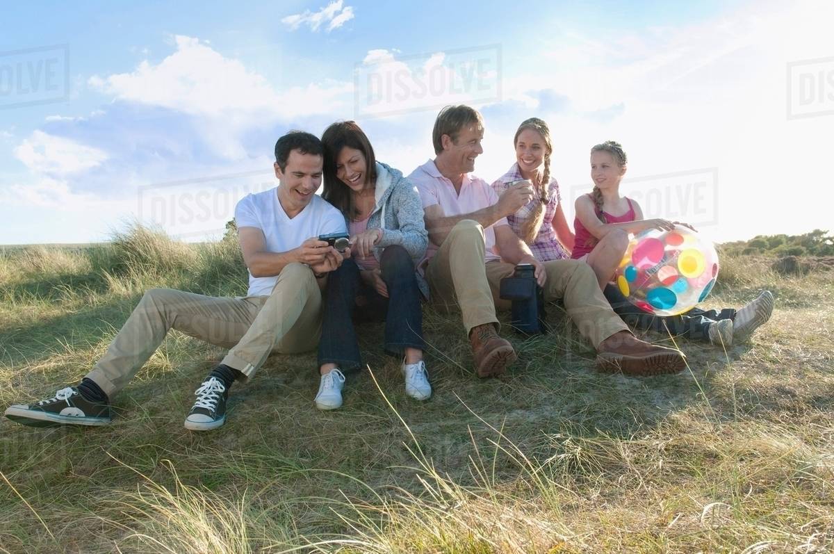 Family relaxing together outdoors - Royalty-free Stock Photo | Dissolve