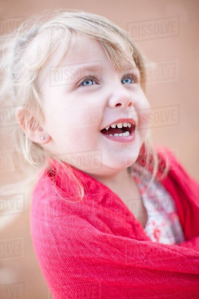 Close up of girls smiling face - Royalty-free Stock Photo | Dissolve