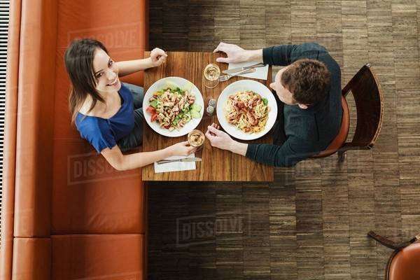 Couple having lunch at cafe - Royalty-free Stock Photo | Dissolve