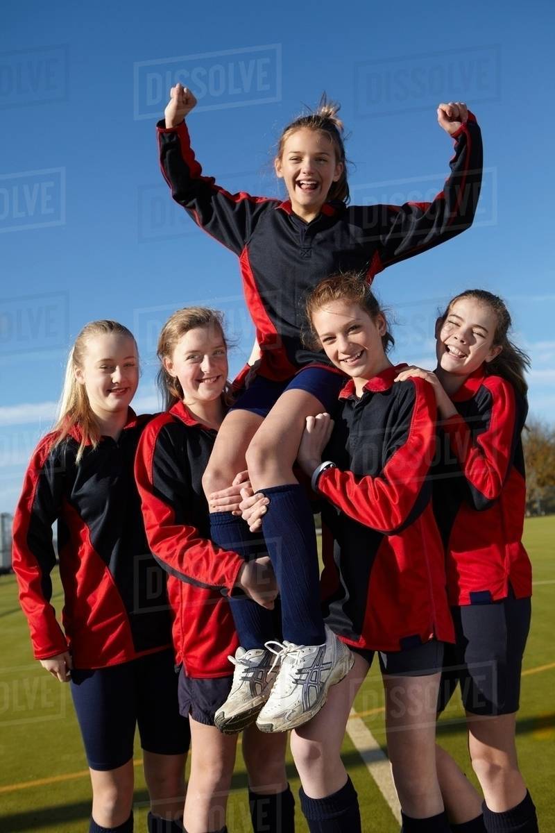 Sports team cheering together - Stock Photo - Dissolve