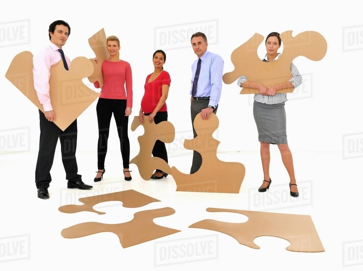 Business people doing jigsaw puzzle - Royalty-free Stock Photo | Dissolve