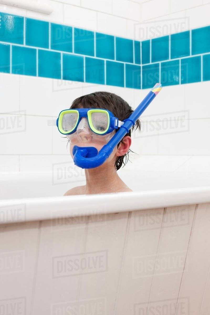 Boy wearing snorkel mask in bath - Royalty-free Stock Photo | Dissolve