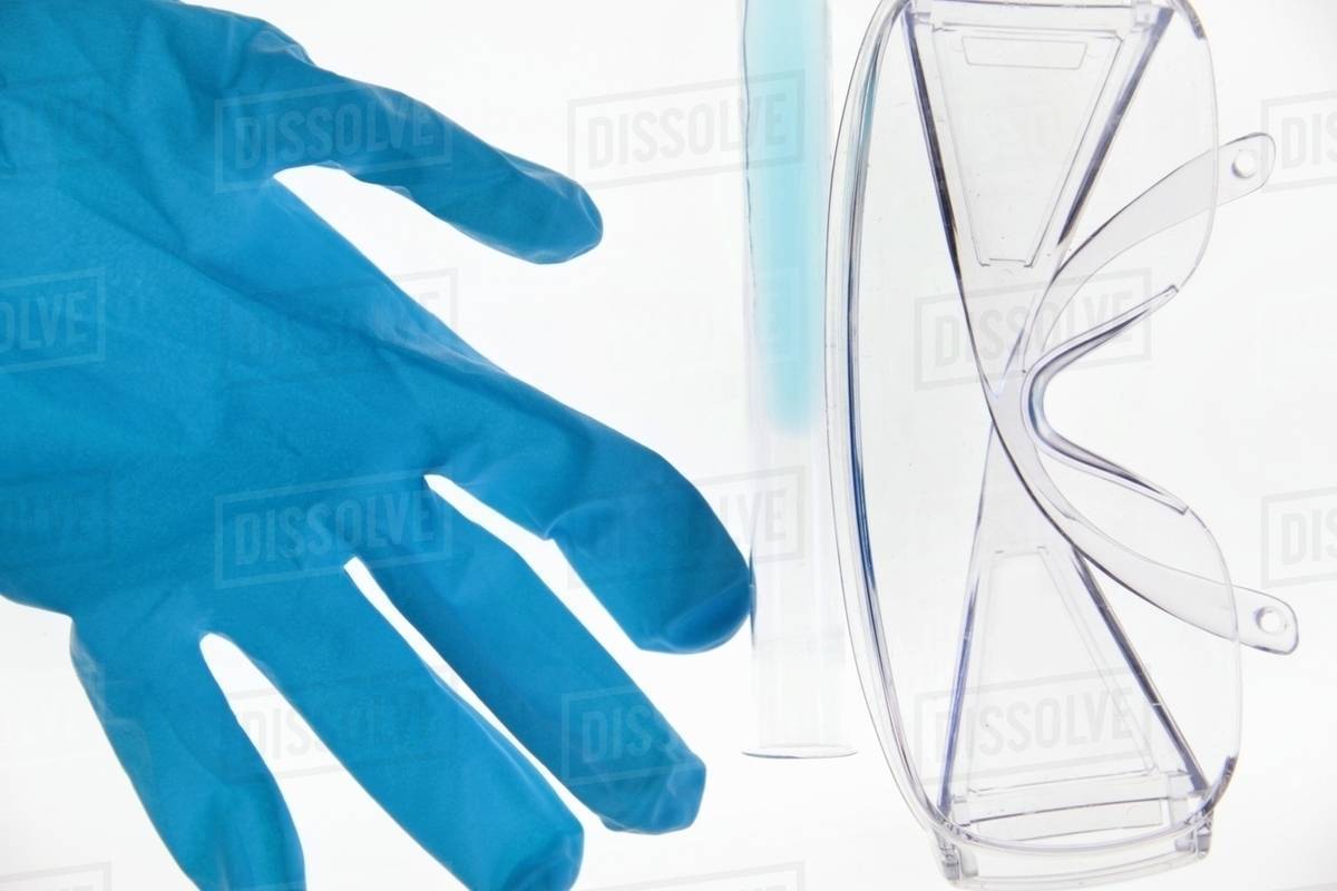 Latex glove, goggles and test tube - Royalty-free Stock Photo | Dissolve