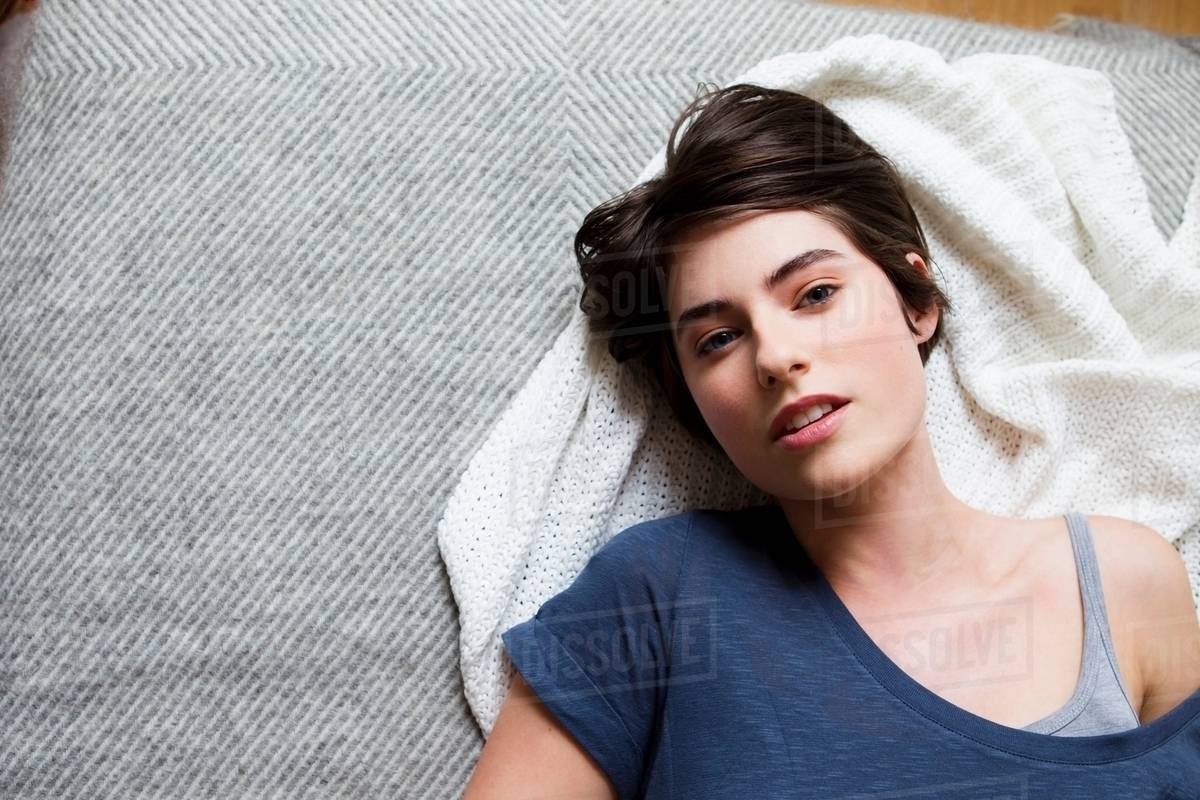 Woman laying on blanket - Royalty-free Stock Photo | Dissolve