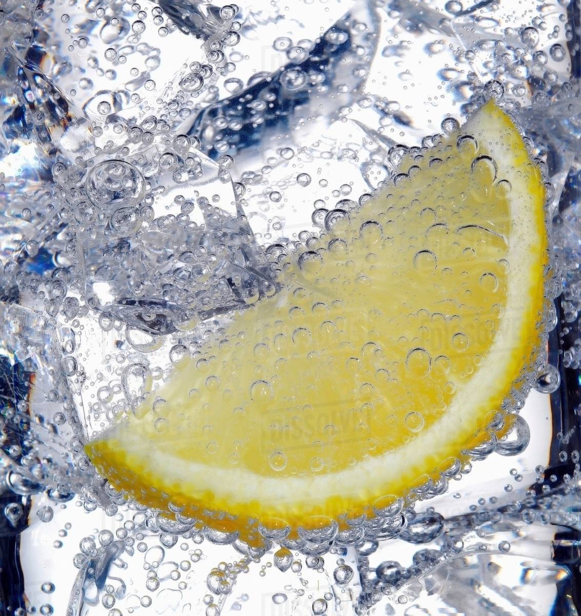 Fizzy lemon juice with ice cubes - Royalty-free Stock Photo | Dissolve