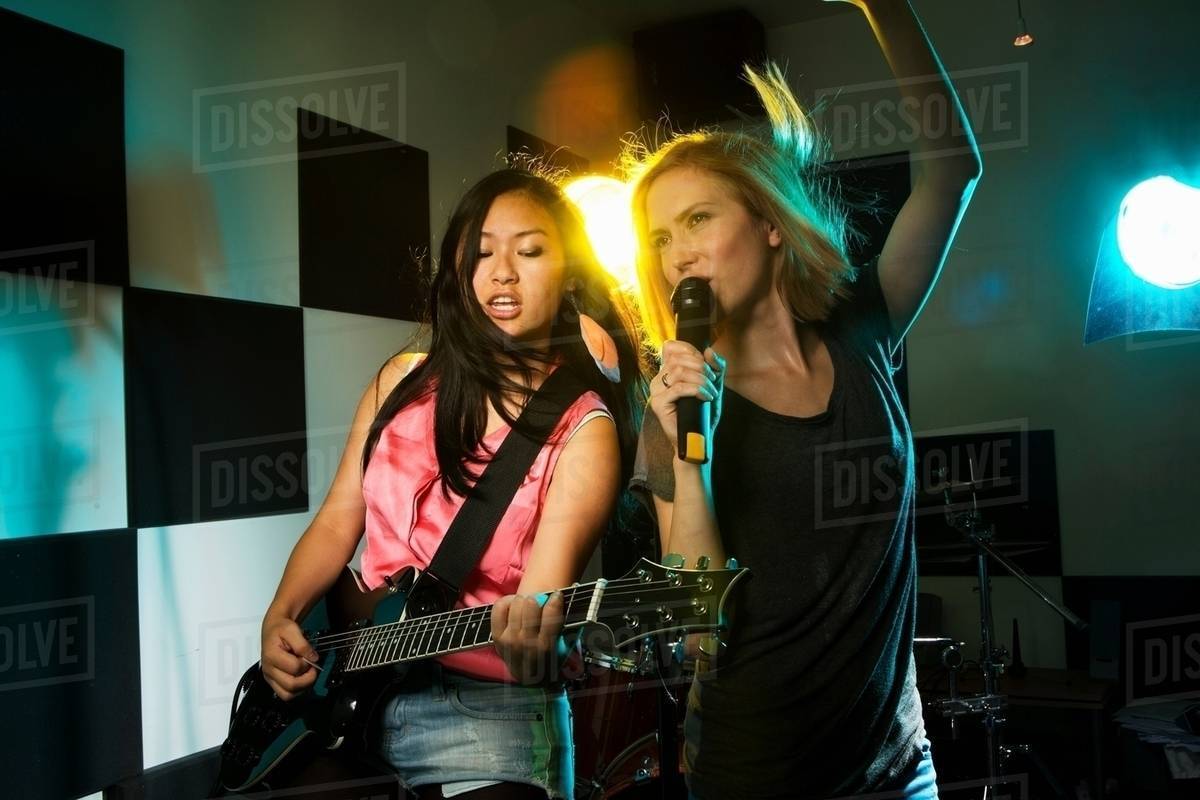 Female music band performing - Royalty-free Stock Photo | Dissolve