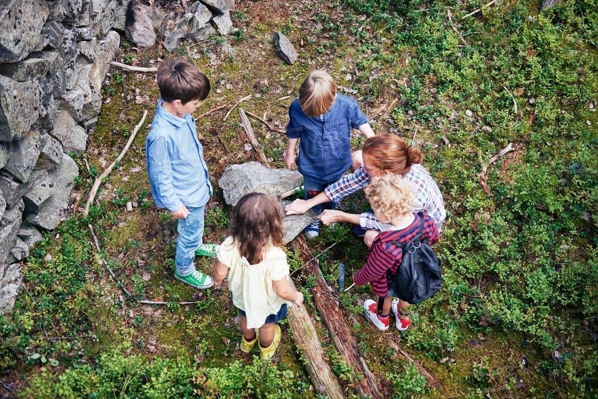 Family exploring in forest - Royalty-free Stock Photo | Dissolve
