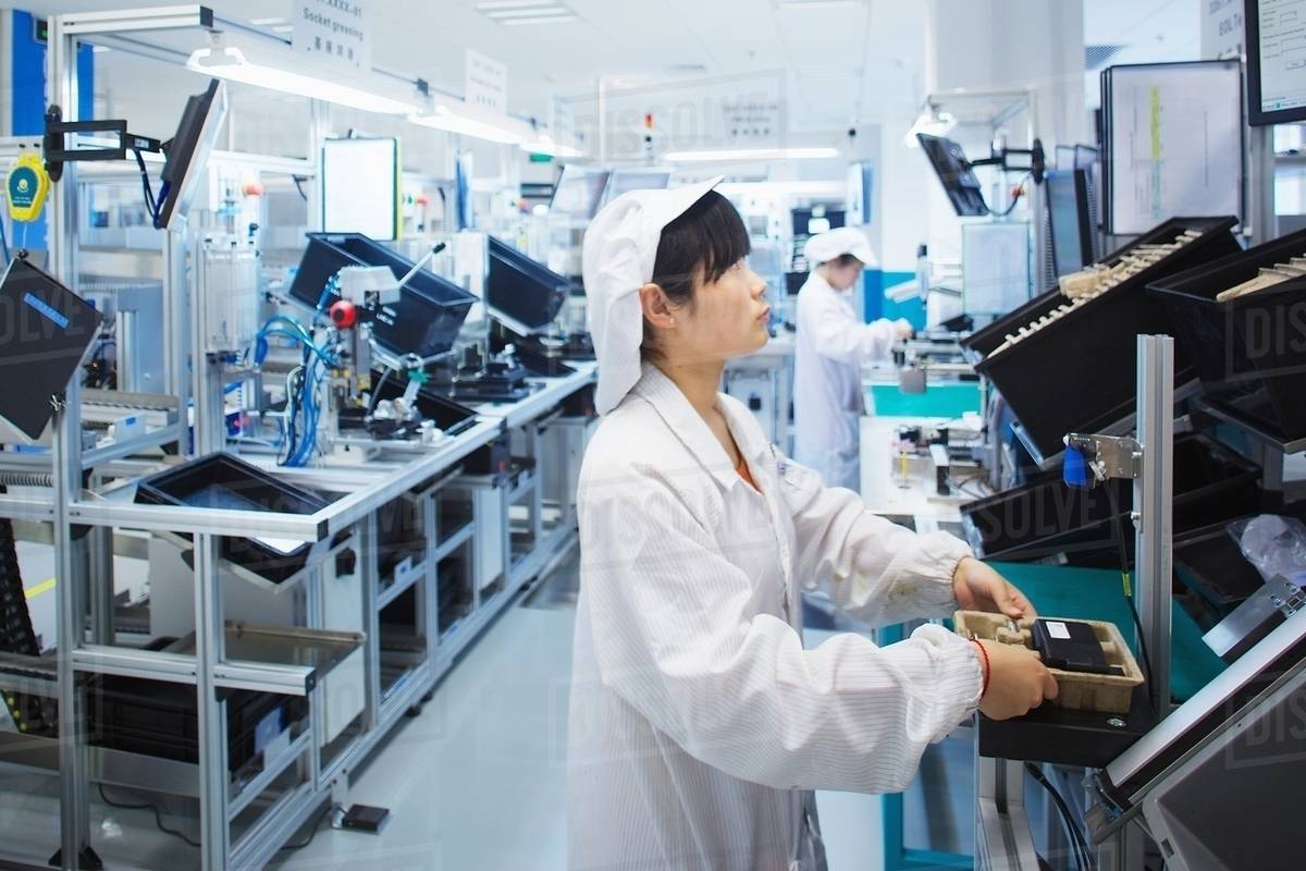 Worker at small parts manufacturing factory in China - Stock Photo ...